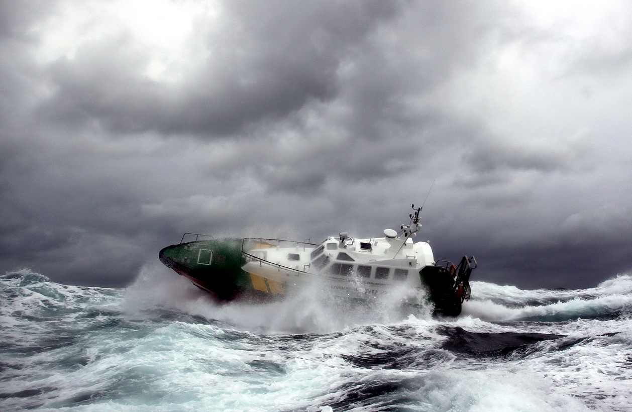 A vessel rolling in heavy weather conditions.